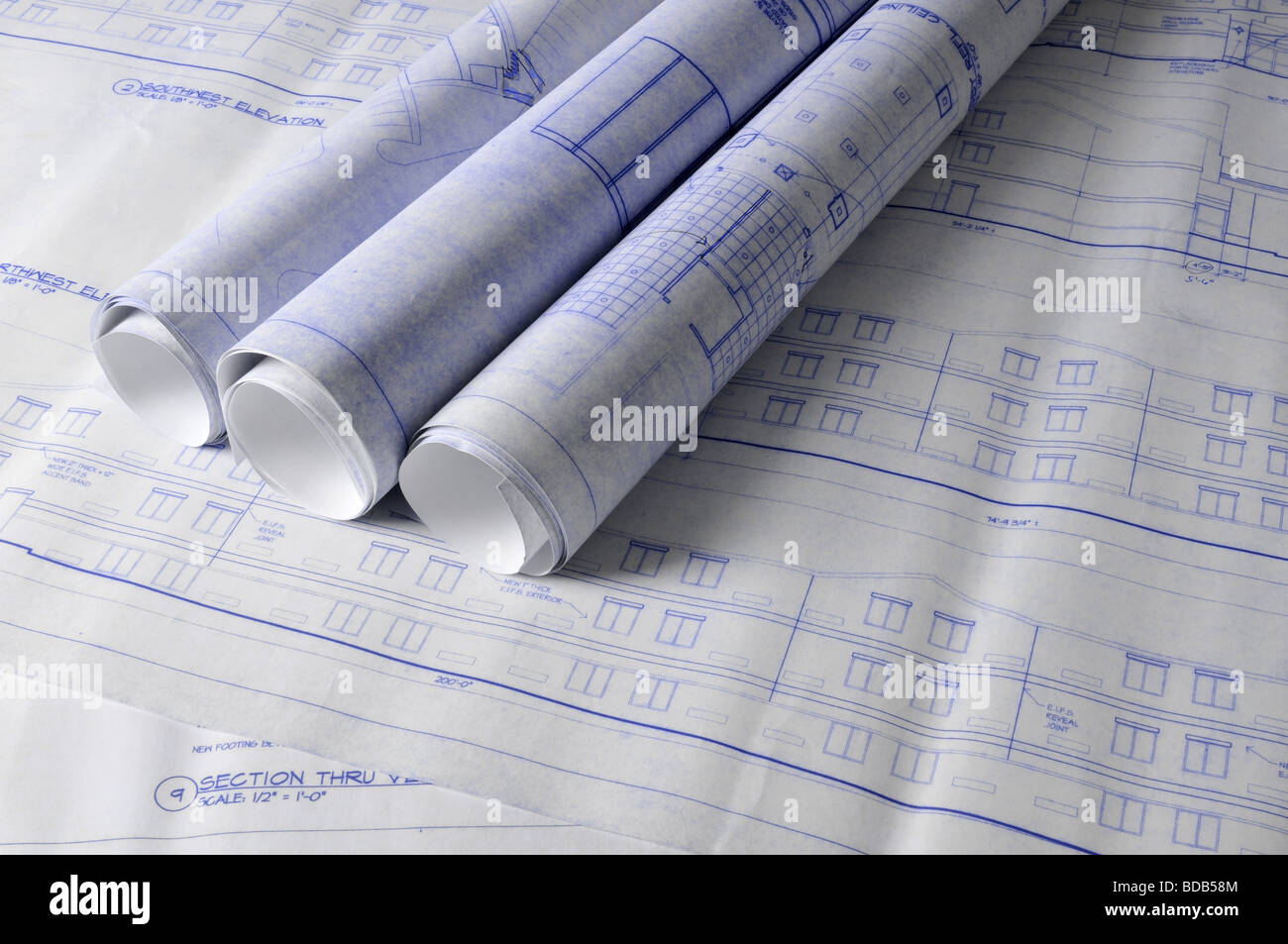 Architectural blueprints on a drawing table Stock Photo - Alamy