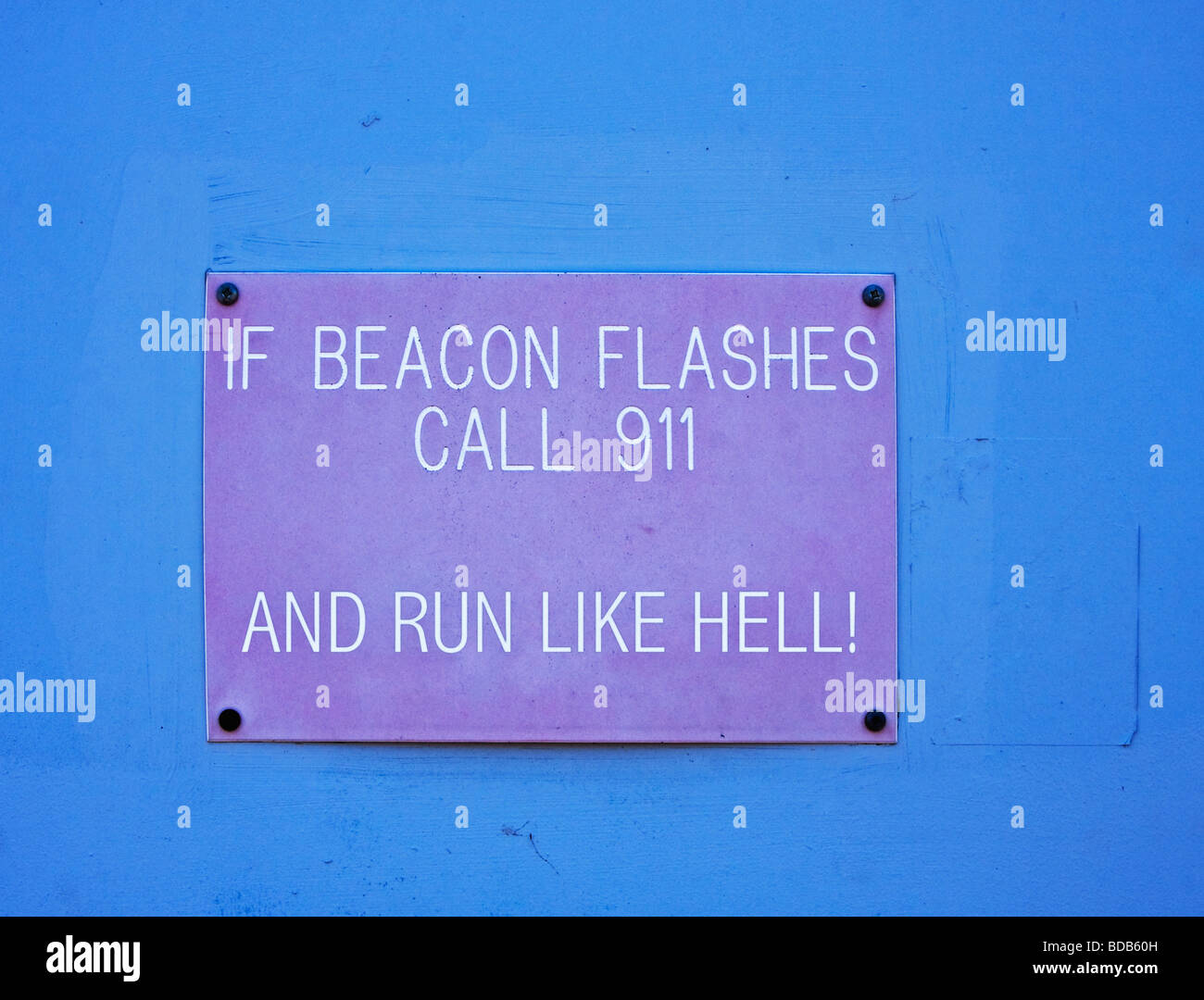 funny emergency sign mounted on wall Stock Photo - Alamy