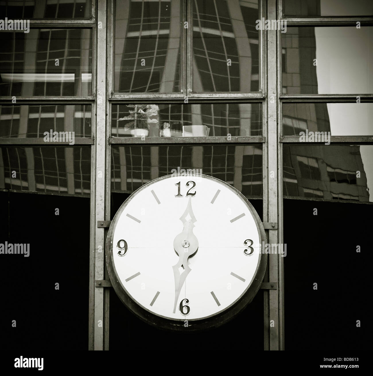 Clock above entrance to building Stock Photo - Alamy