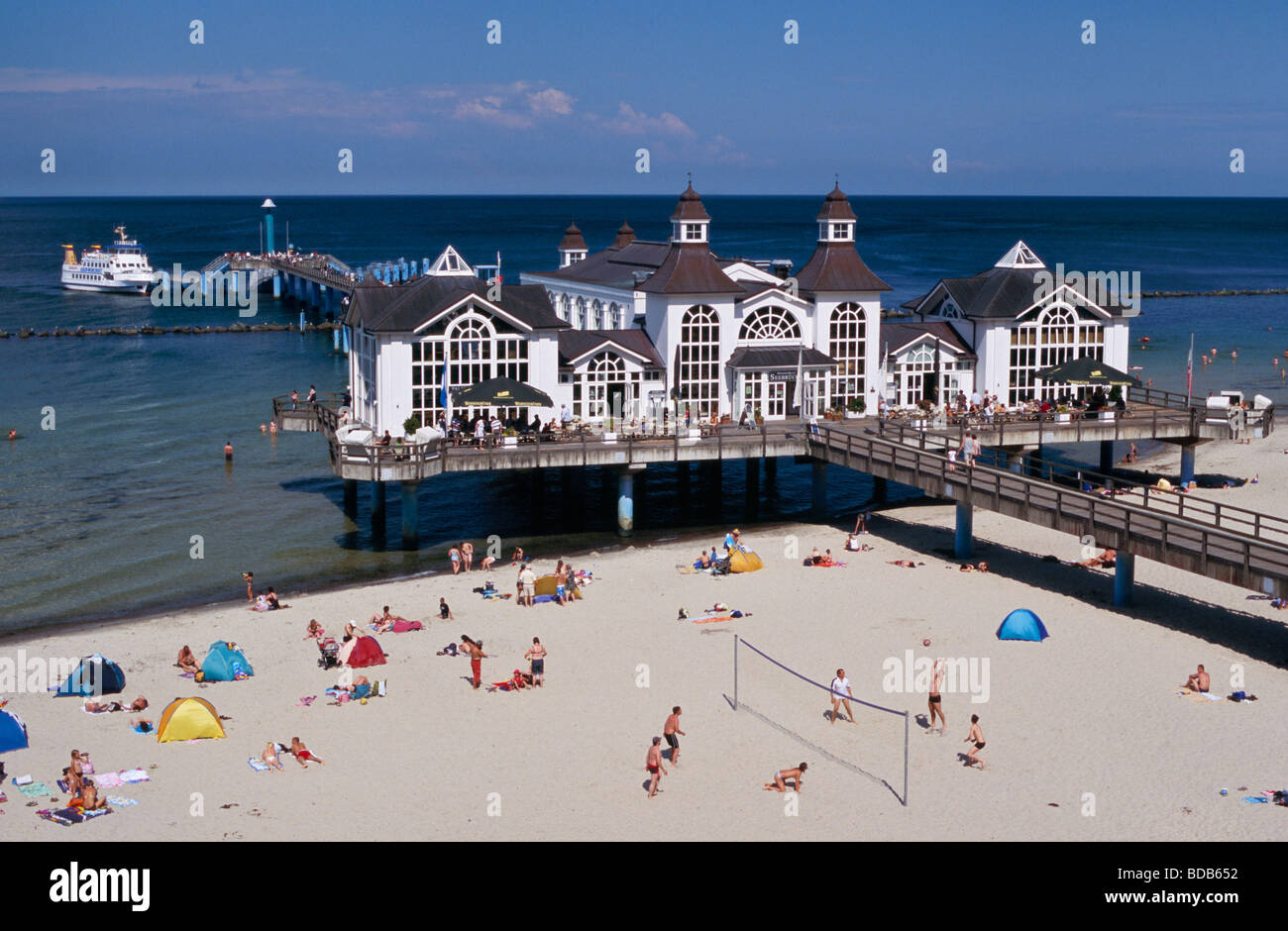 Beach and pier with ship in Ostseebad Sellin on the island of Rügen in ...