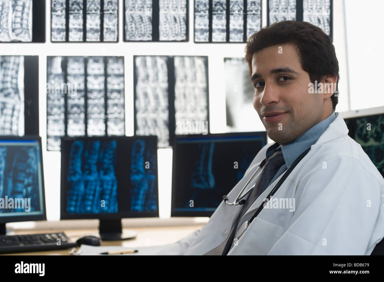 Portrait of a male doctor smiling Stock Photo - Alamy