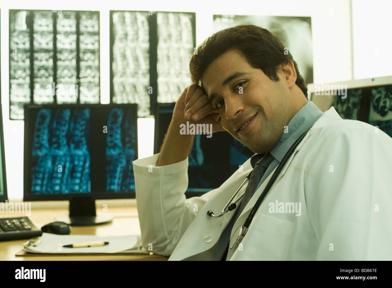 Portrait of a male doctor smiling Stock Photo - Alamy