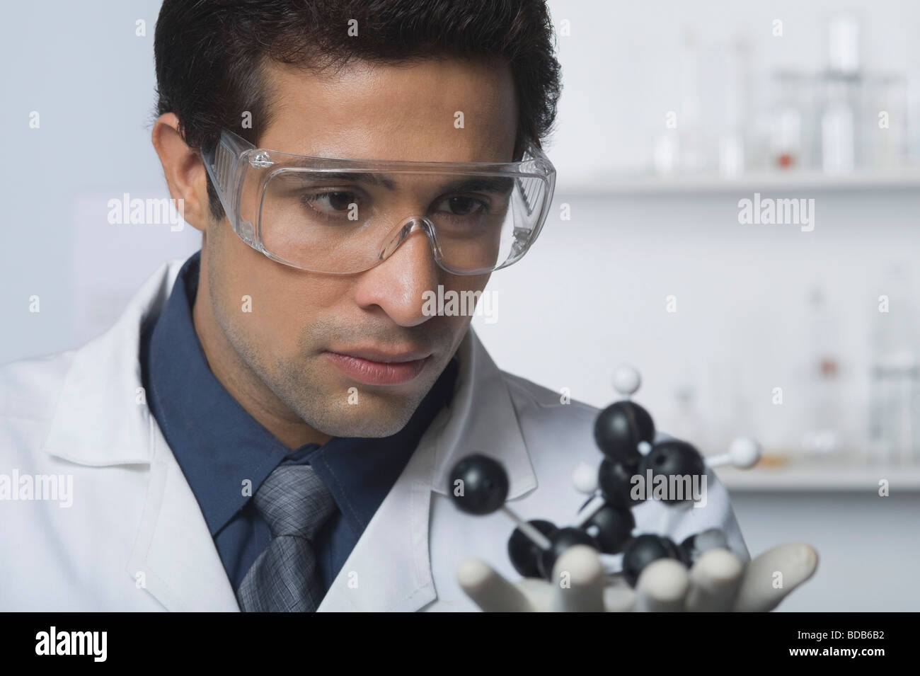 Scientist holding molecular model in a laboratory Stock Photo - Alamy