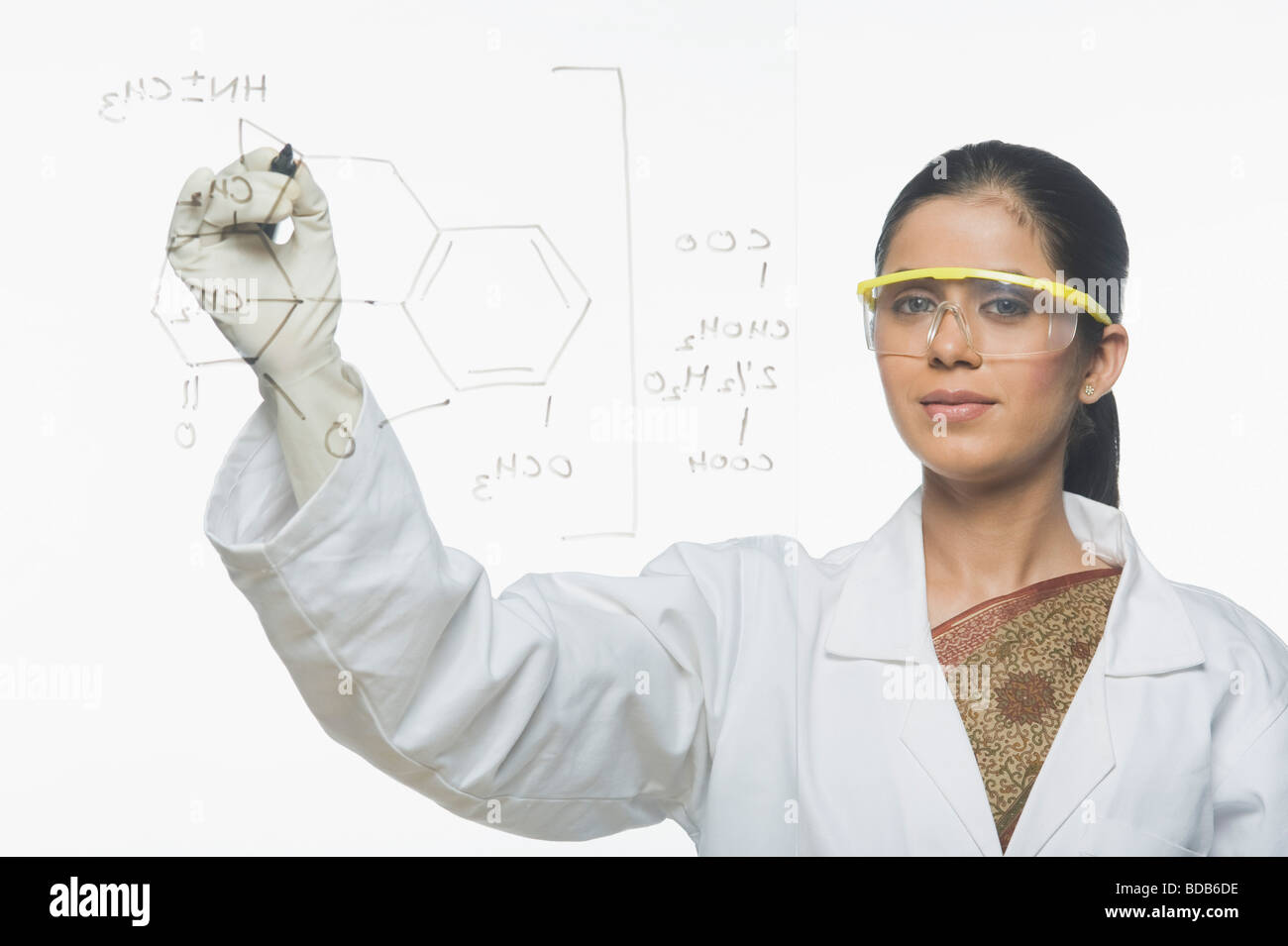 Scientist writing chemical formula Stock Photo - Alamy
