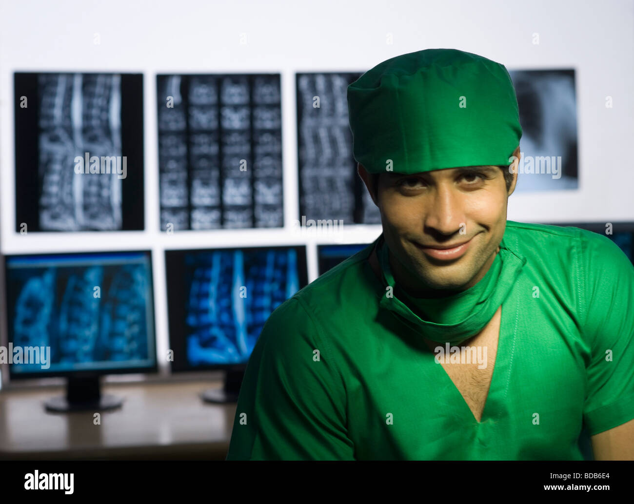 Portrait of a male surgeon smiling Stock Photo - Alamy