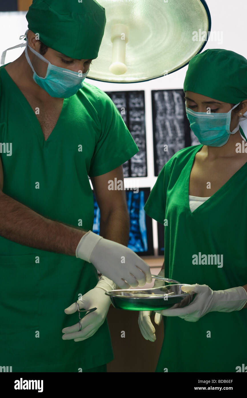 Surgeons performing surgery in an operating room Stock Photo - Alamy