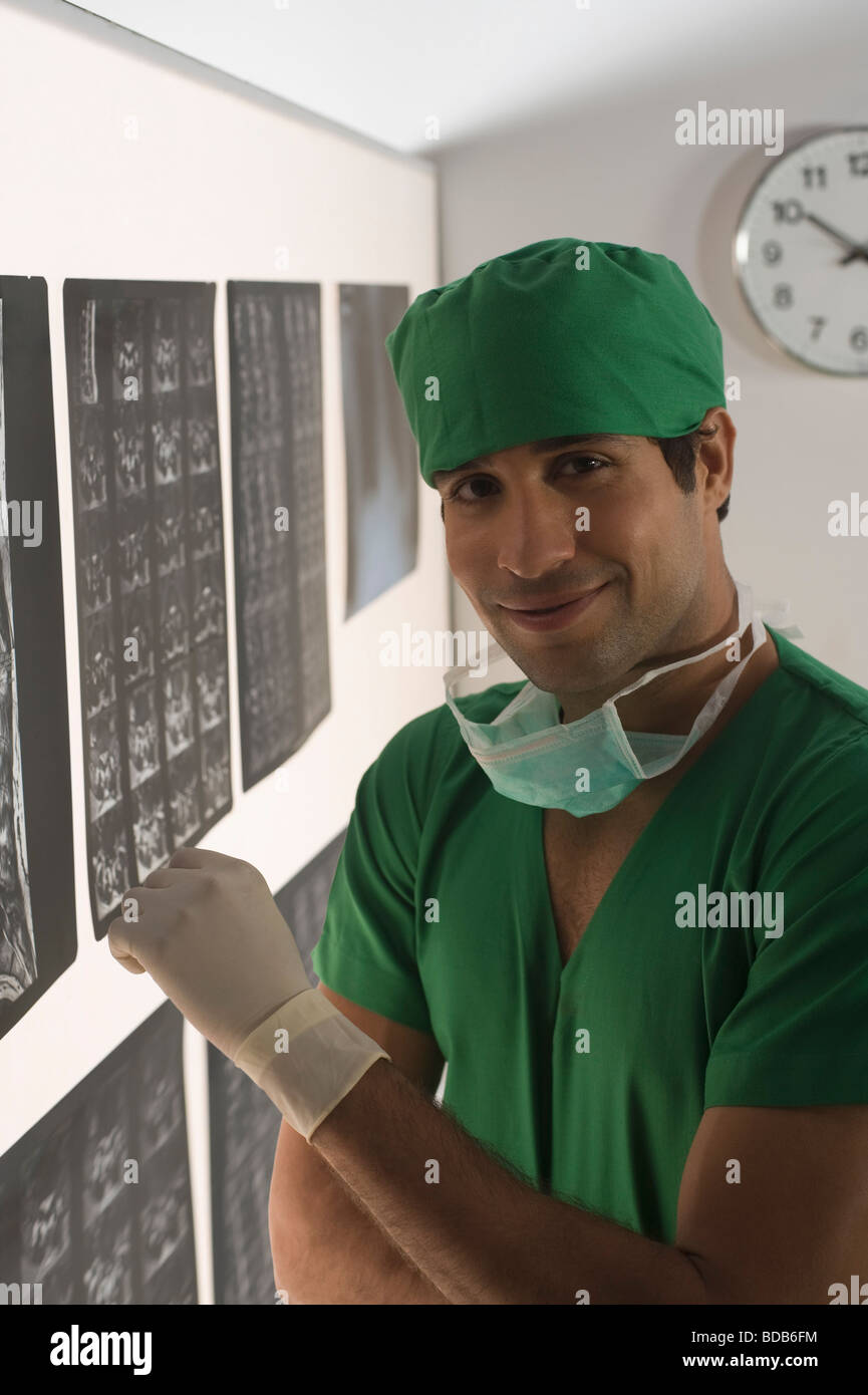 Portrait of a male surgeon smiling Stock Photo - Alamy