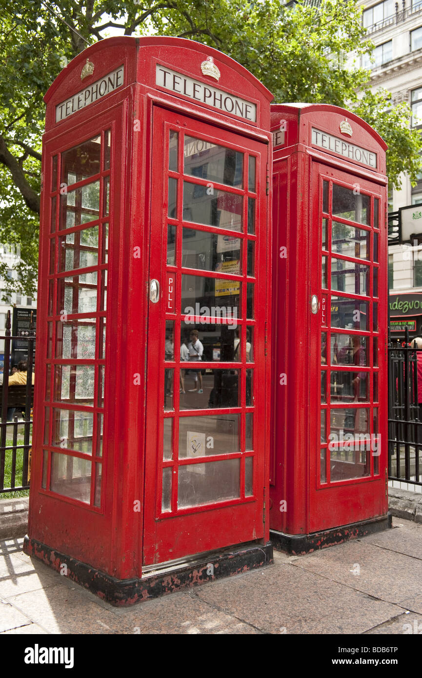 Two traditional British red public telephone / phone boxes standing ... Two traditional British red public telephone / phone boxes standing ...
