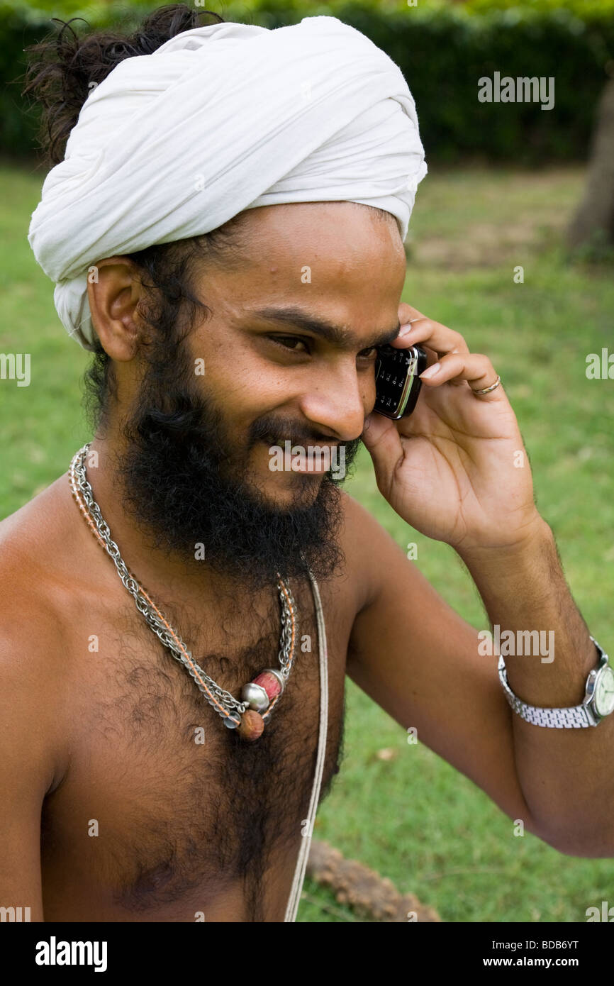 Sikh visitor to the Red Fort in Delhi making a call from his cell ...