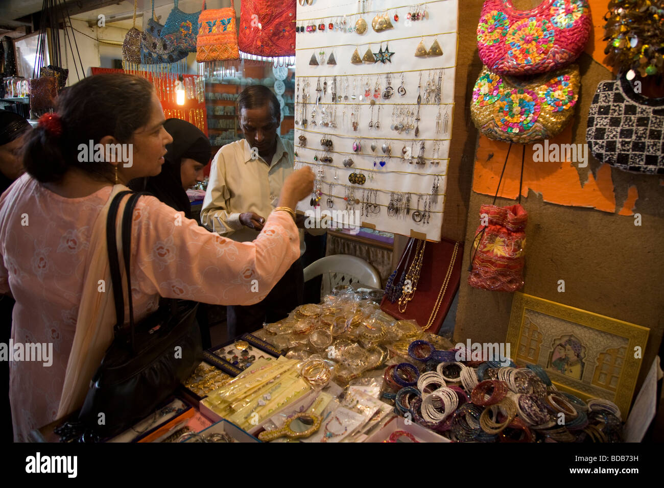 Indian woman tourists examine jewellery for sale at a gift shop. Chatta ...