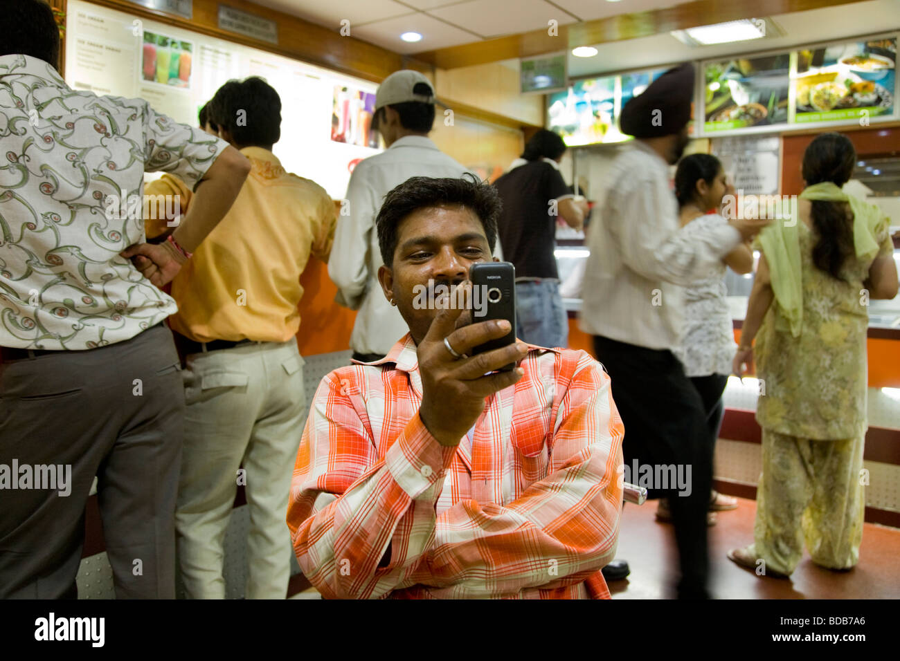 Indian customer in n Haldirams restaurant – Delhi – dialing, text ...