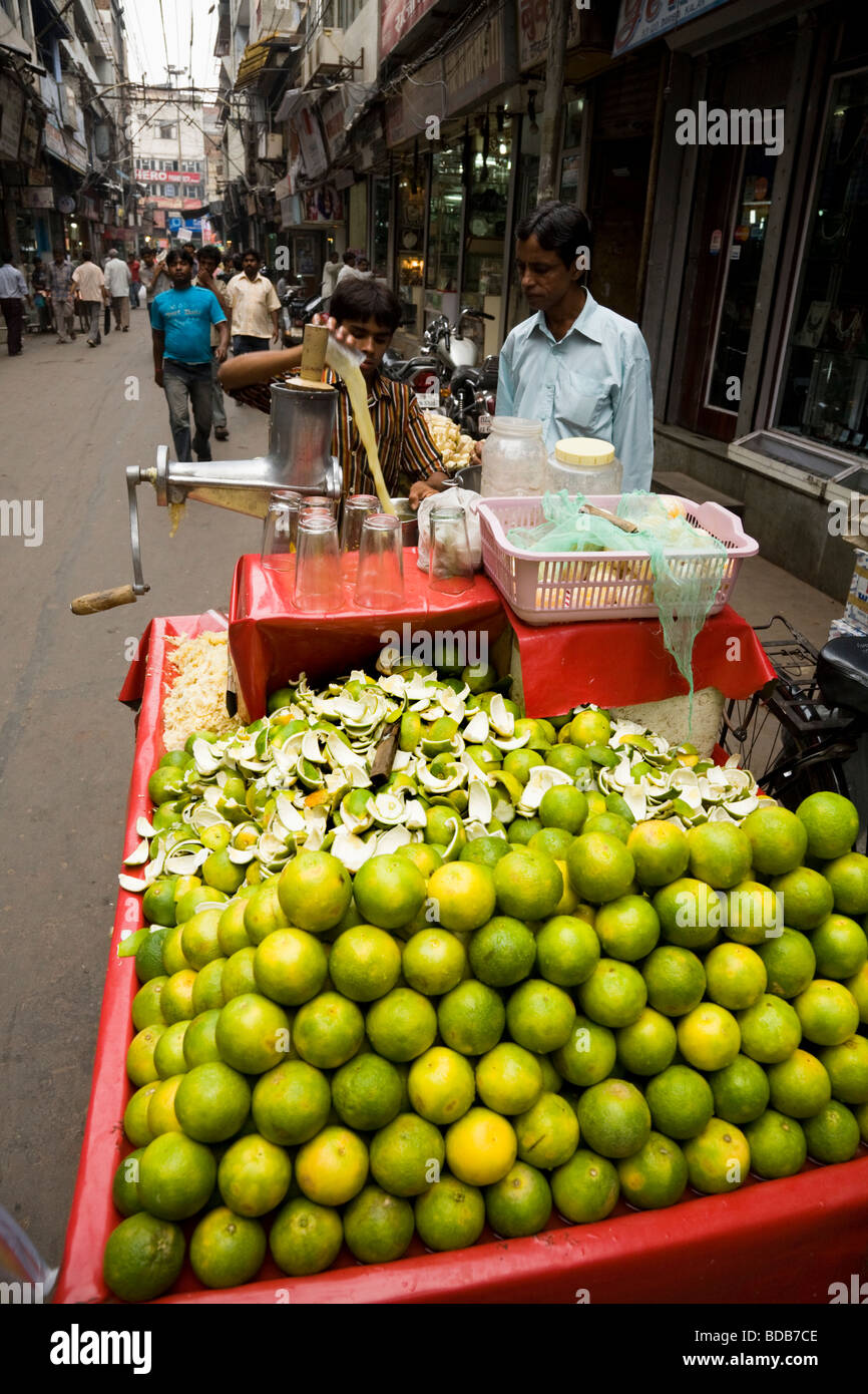 Citrus fruit juice seller with fresh squeezed juice, in the street in ...