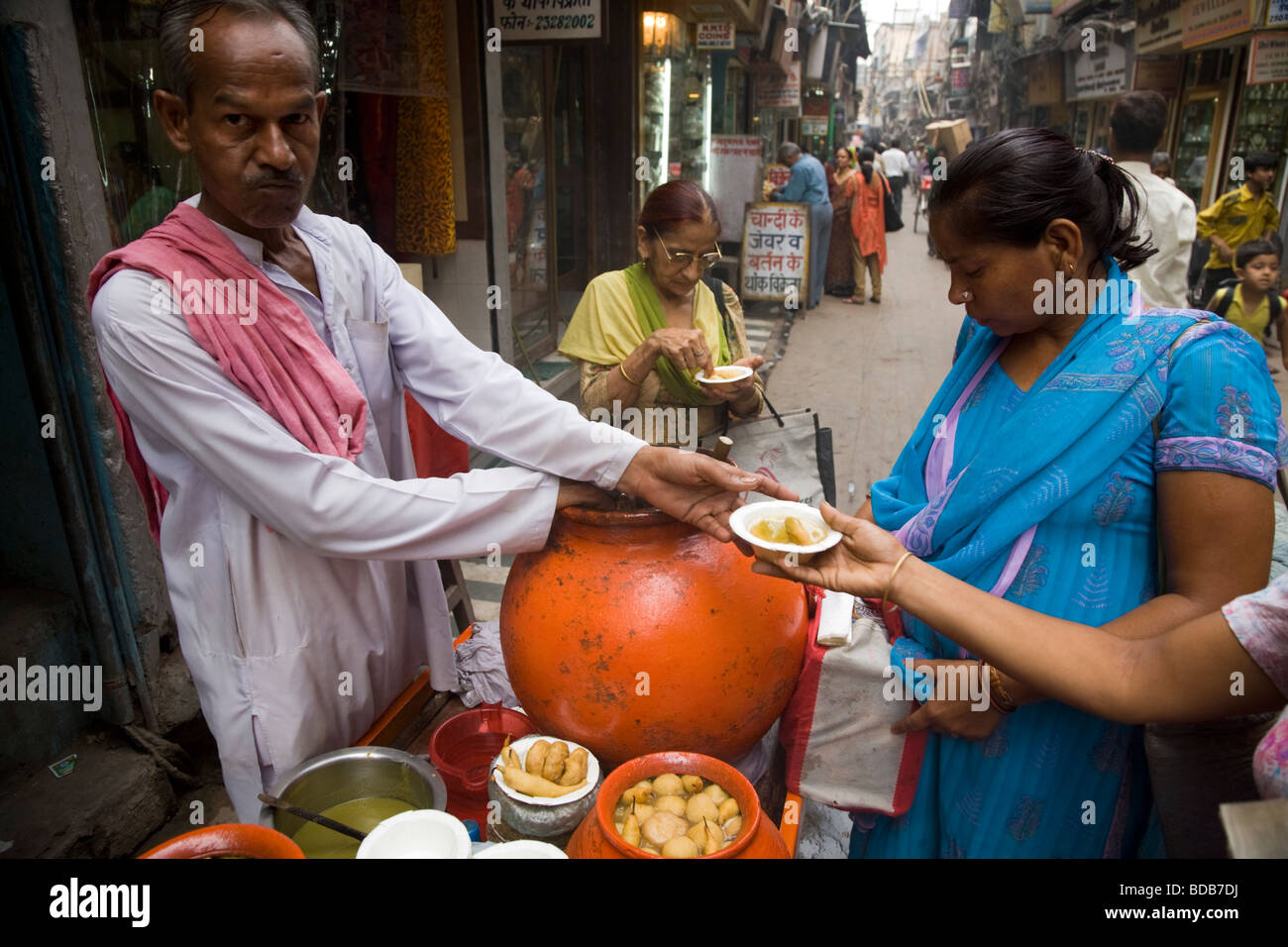 Indian street vendor seller selling sweet pears in syrup for sale in ...