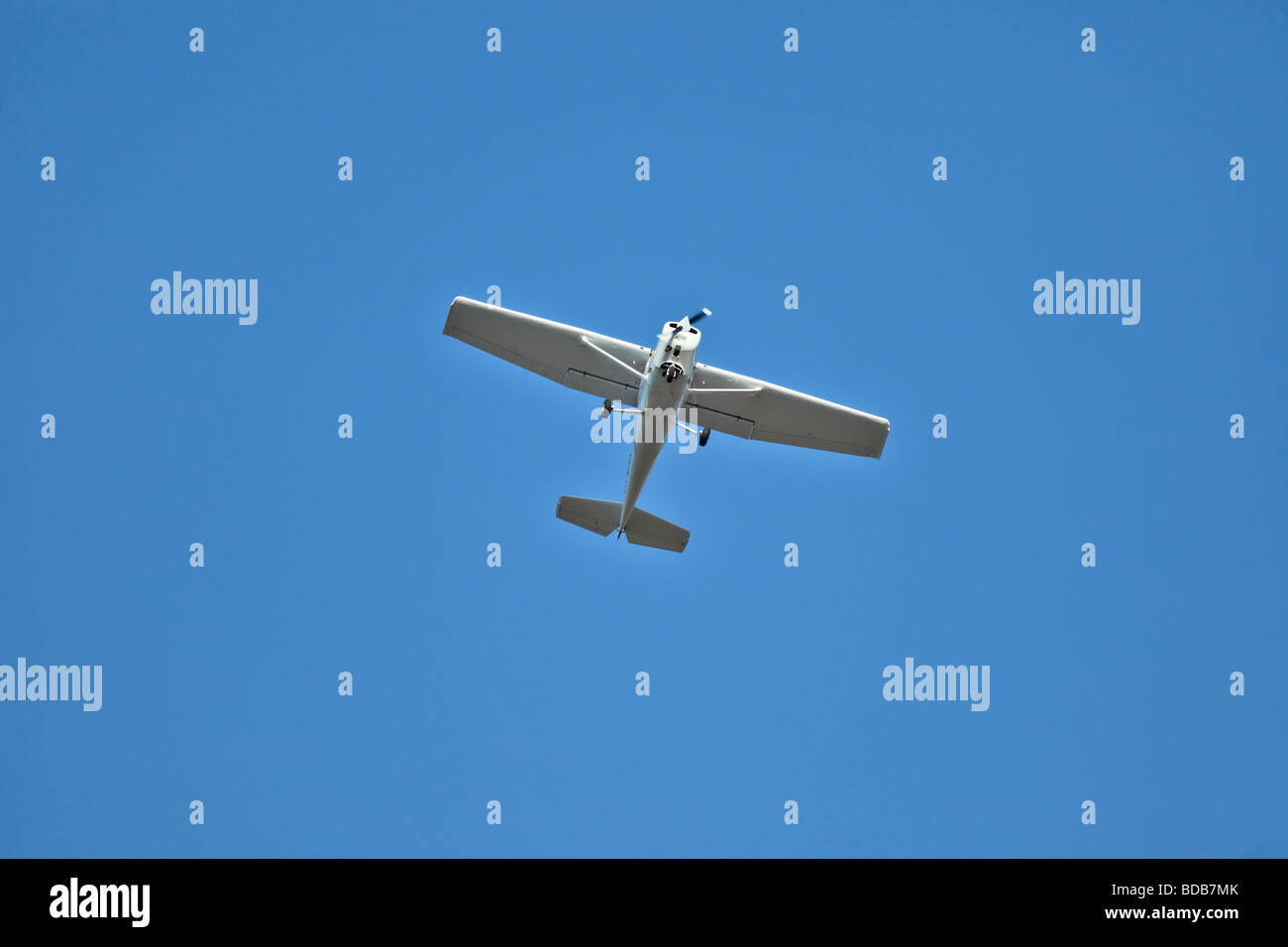 Cessna single engine aircraft flying against a clear blue sky Stock ...