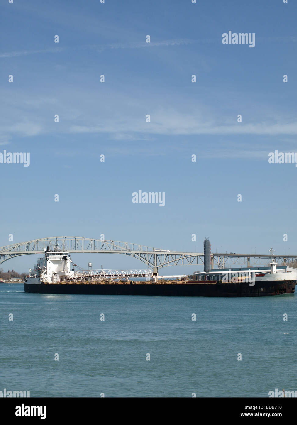 Lake Freighter with Blue Water Bridge in background Stock Photo - Alamy