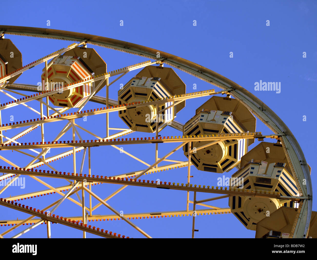 Ferris wheel perspective against blue sky Stock Photo - Alamy