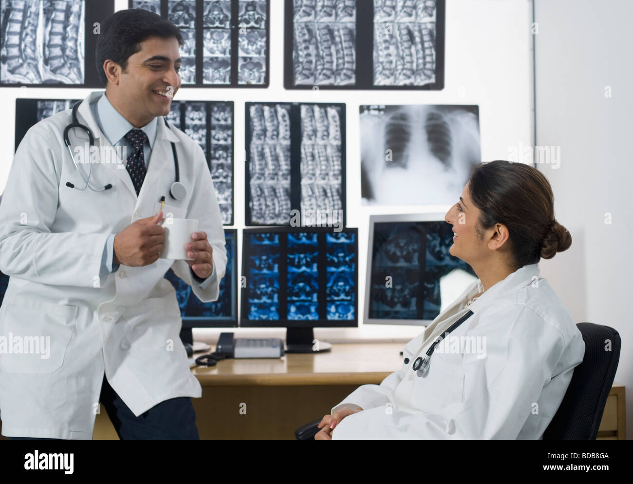 Doctors talking in a hospital Stock Photo - Alamy