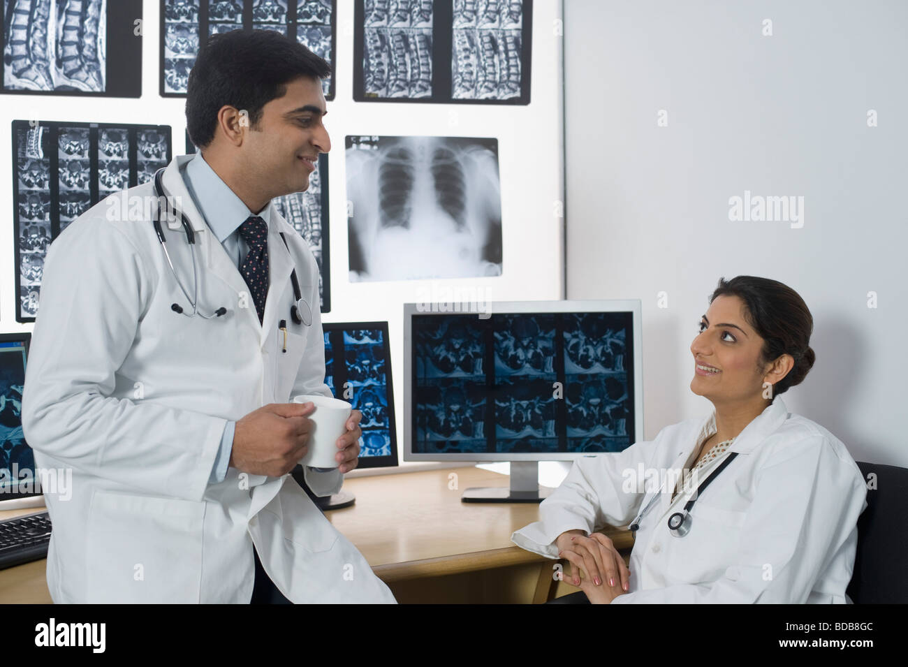 Doctors talking in a hospital Stock Photo - Alamy