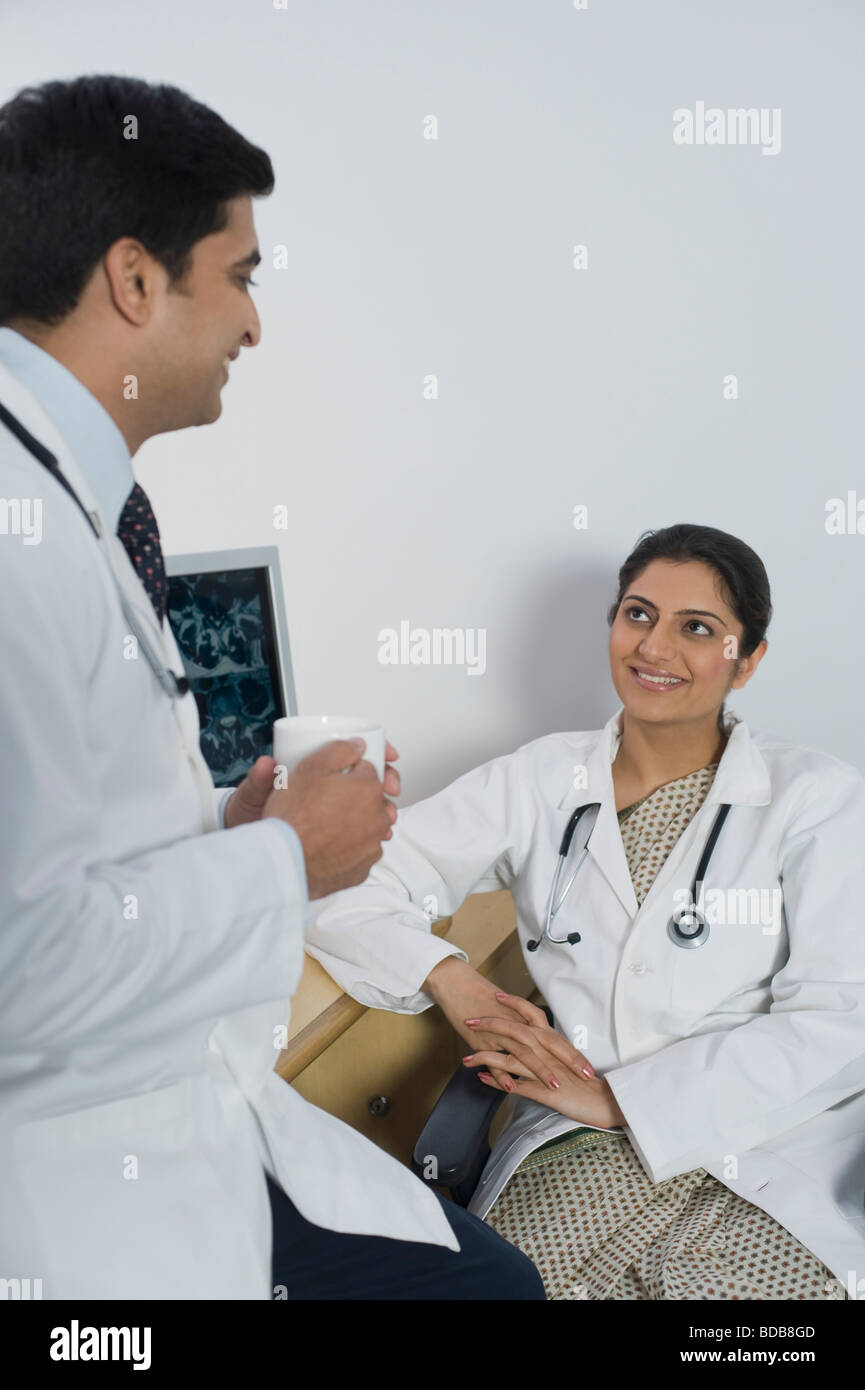 Doctors talking in a hospital Stock Photo - Alamy