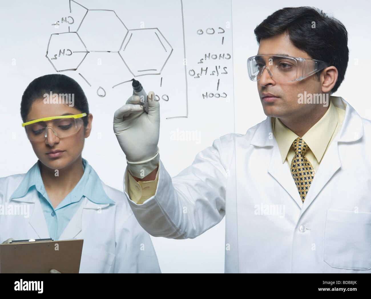Scientists at work on a problem Stock Photo - Alamy