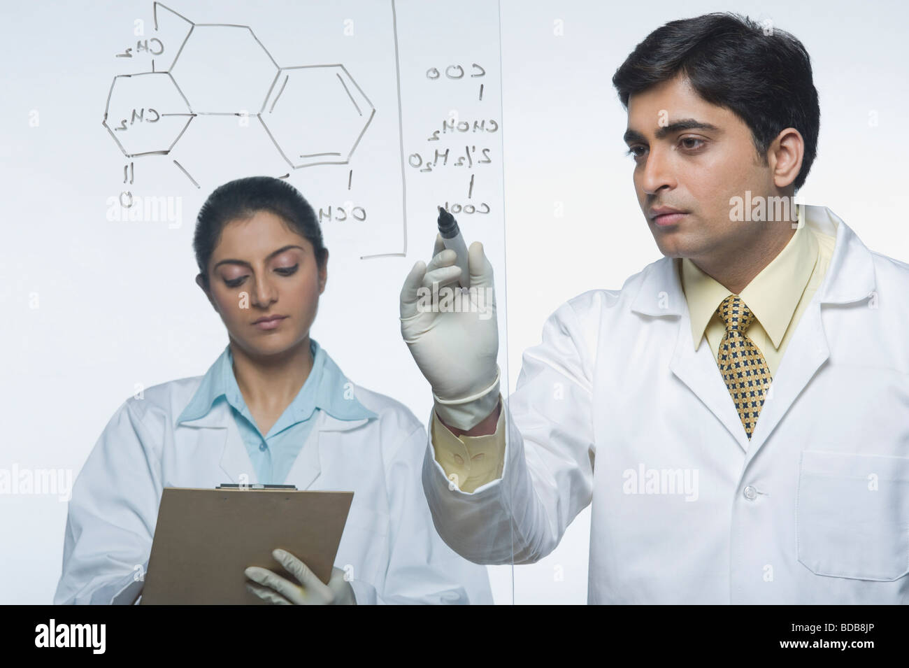 Scientists at work on a problem Stock Photo - Alamy