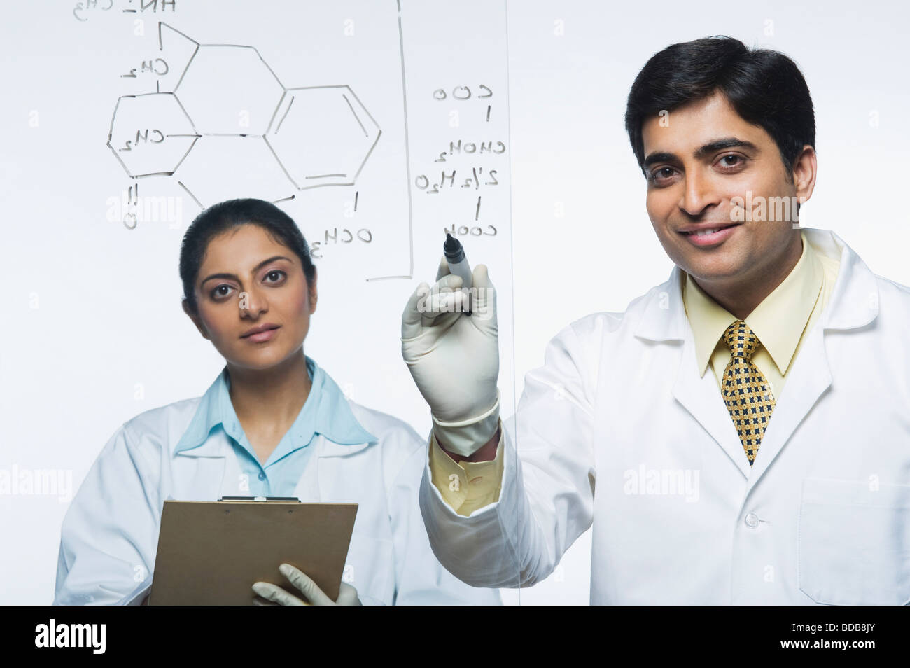Scientists at work on a problem Stock Photo - Alamy