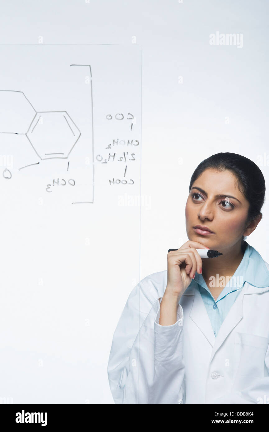 Scientist thinking in a lab Stock Photo - Alamy