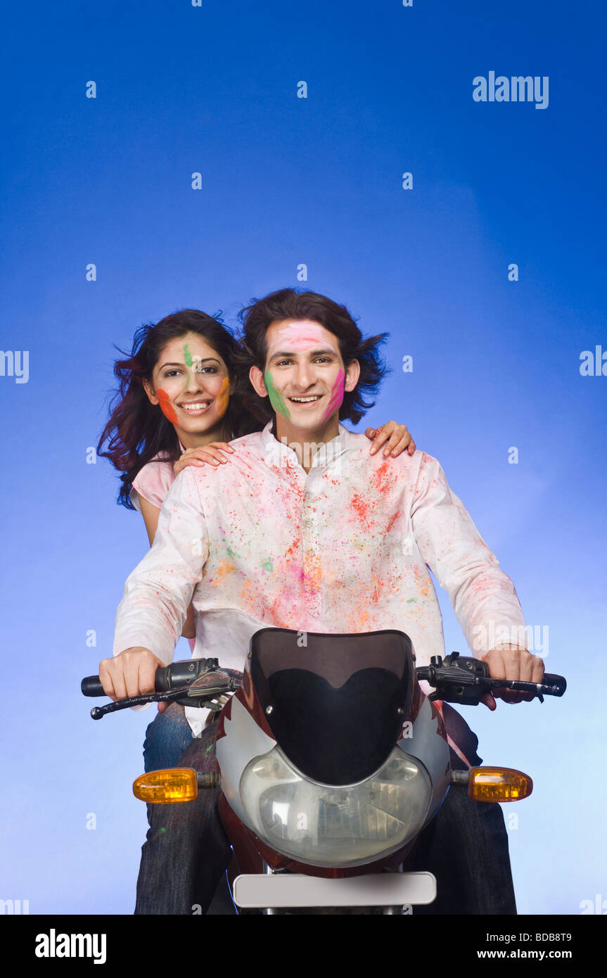 Couple riding a motorcycle Stock Photo - Alamy