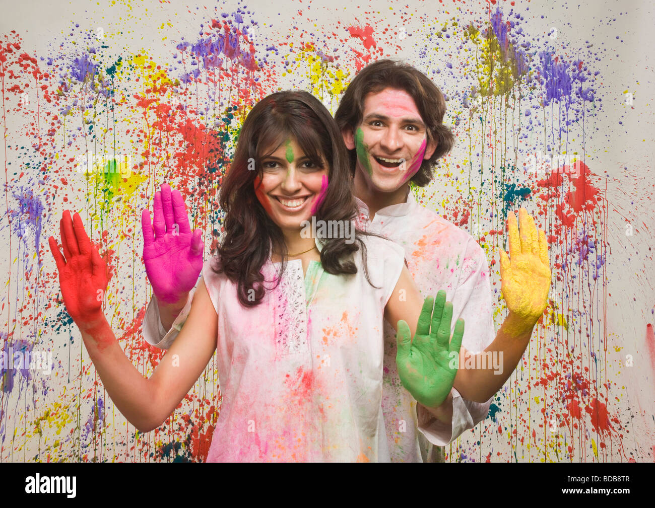 Couple showing their colored hands Stock Photo - Alamy