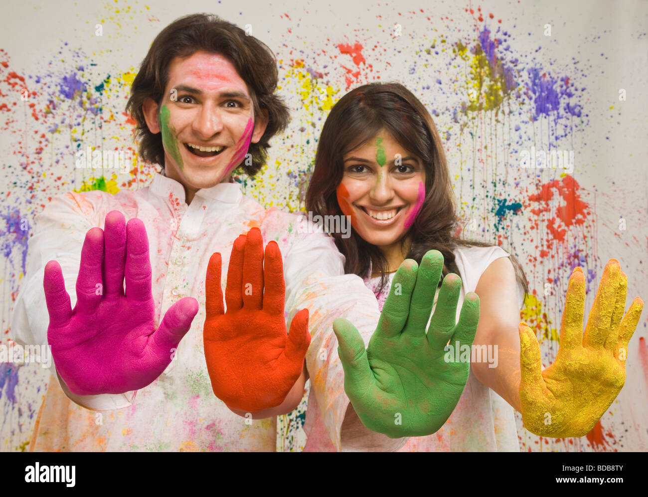Couple showing their colored hands Stock Photo - Alamy