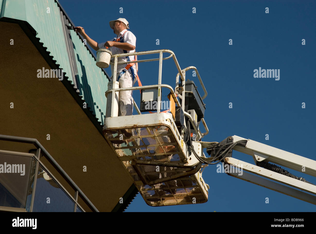 Painters working from a hydraulic boom, Queensland Australia Stock ...