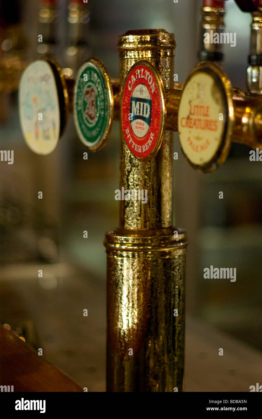Bar counter at an Australian hotel showing beer beer taps with various ...