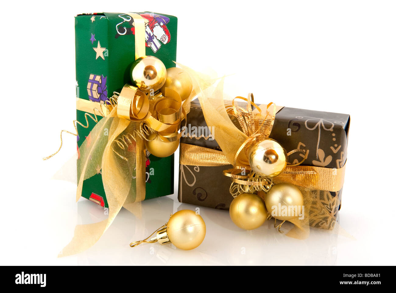 Luxury wrapped Christmas present with balls and ribbon Stock Photo - Alamy
