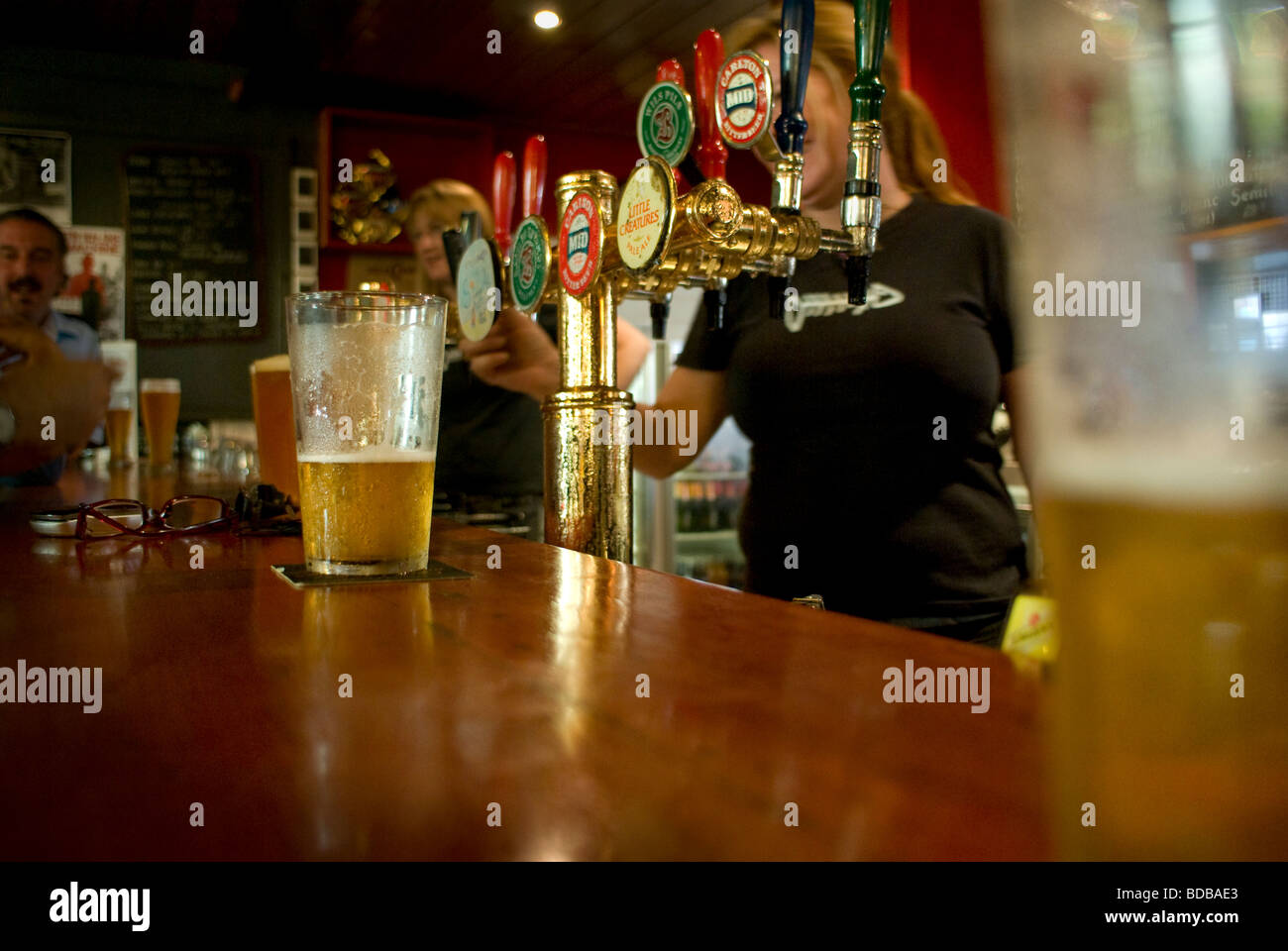 Bar counter at an Australian hotel showing beer glasses, beer taps ...