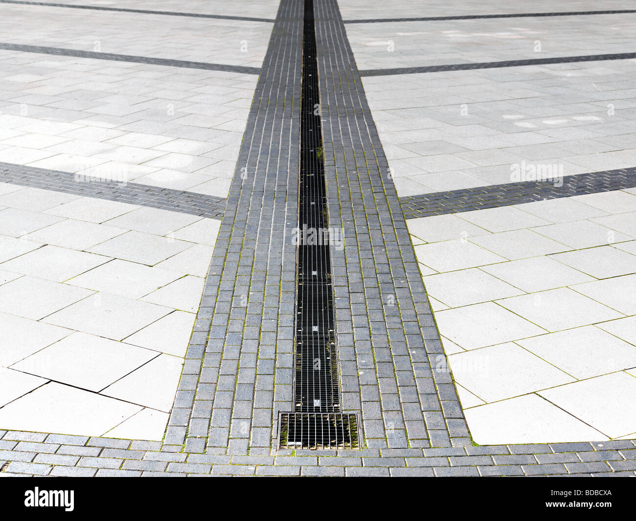 pavement design salford quays manchester drain grid Stock Photo - Alamy