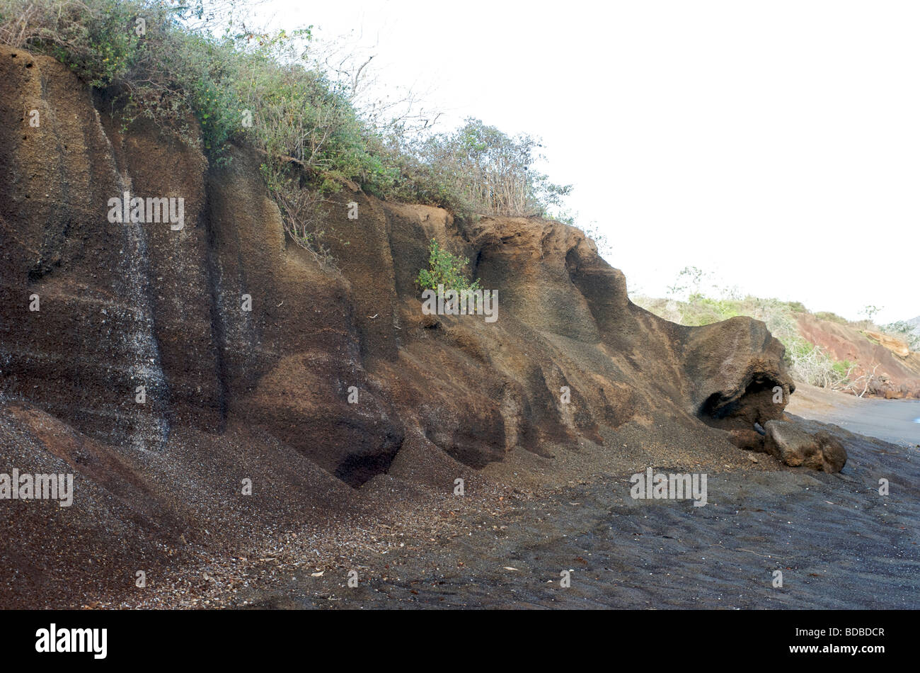 Volcanic cliff above beach on Floreana Island, Galapagos Islands ...