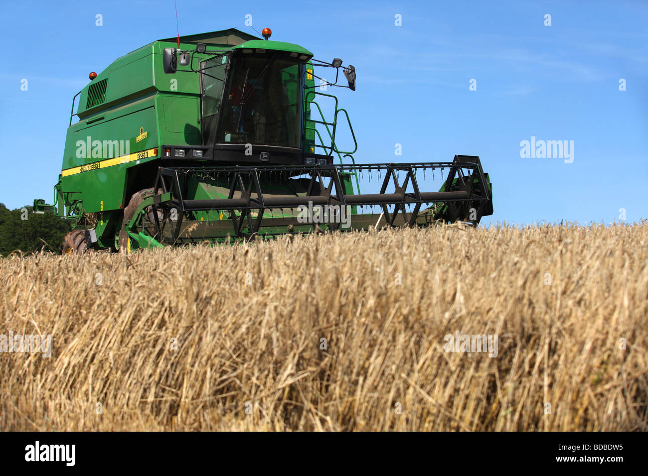 A combine harvester in a field in Devon, UK Stock Photo - Alamy