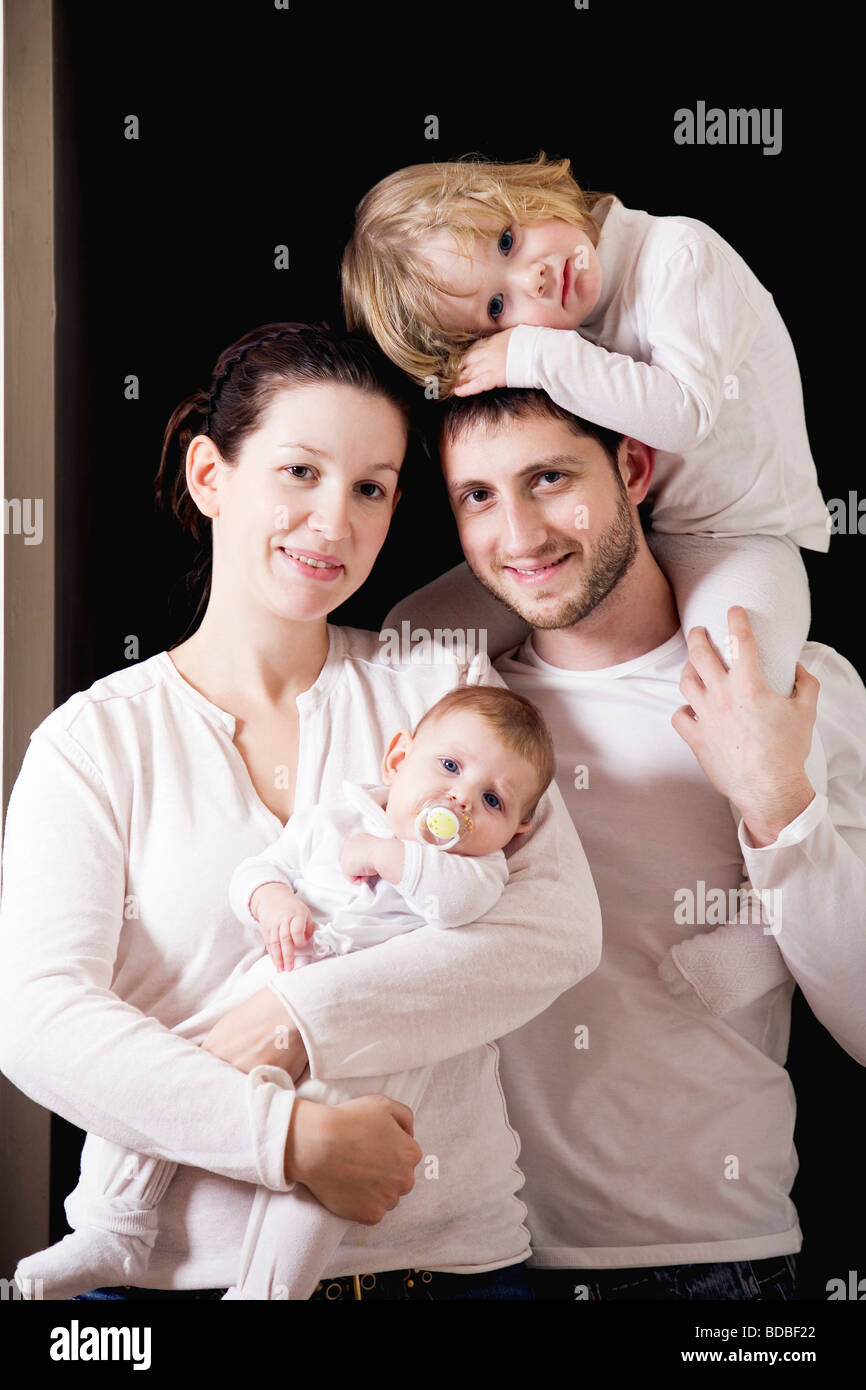 portrait of young family Stock Photo - Alamy