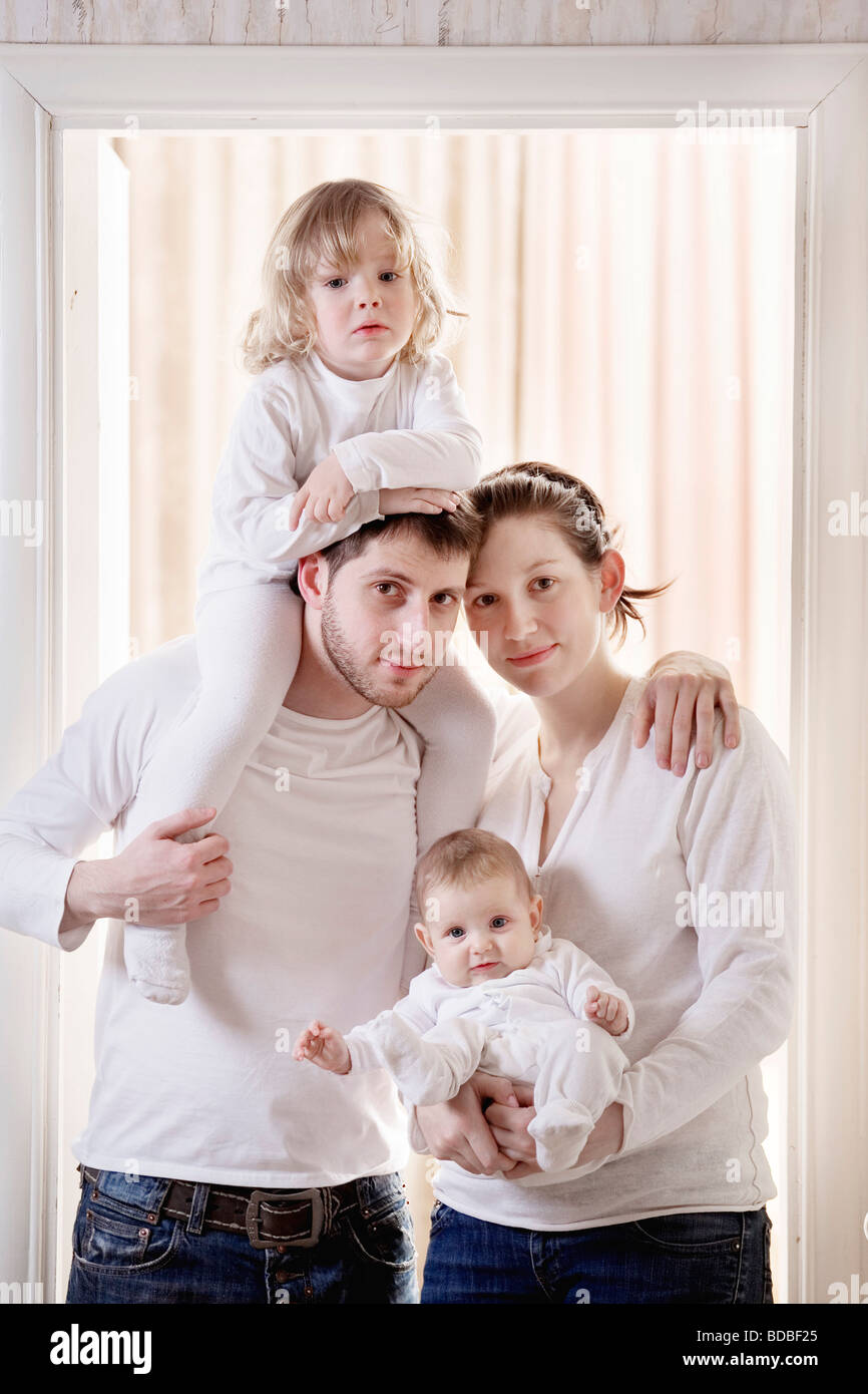 portrait of young family Stock Photo - Alamy