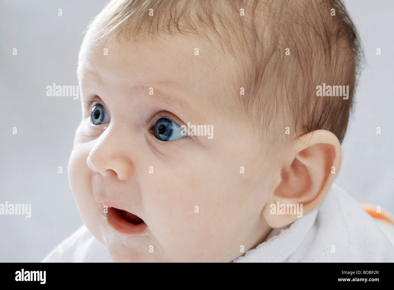 headshot of astonished looking baby Stock Photo - Alamy