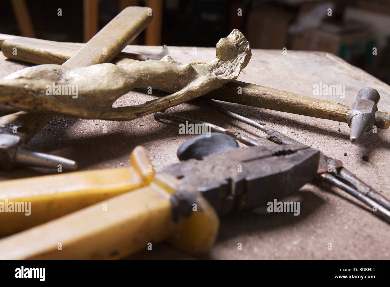 wooden statue and tools in workshop Stock Photo - Alamy