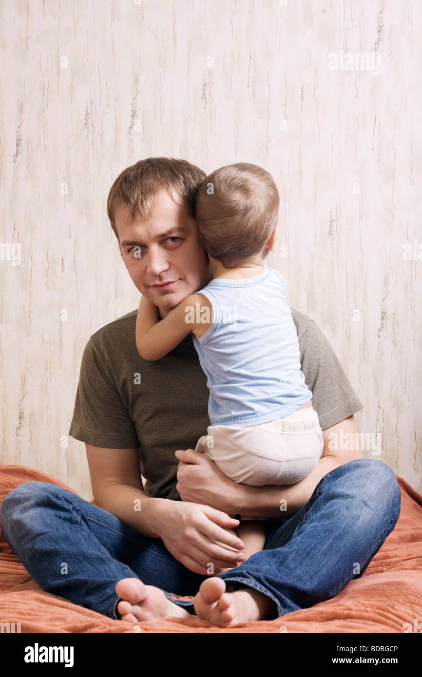 portrait of father holding his young son Stock Photo - Alamy