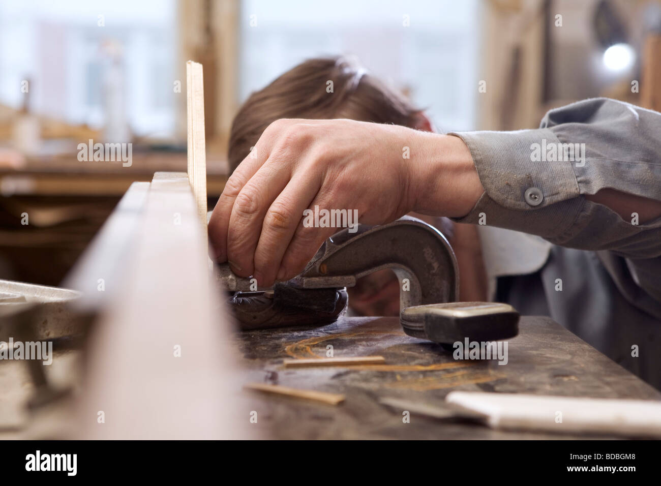 carpenter fixing piece of wood with hand-vice Stock Photo - Alamy