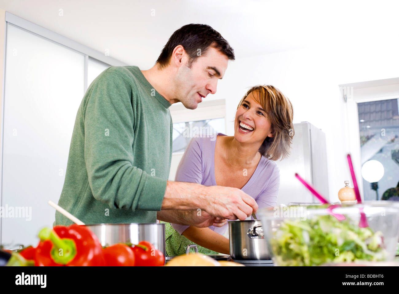 couple cooking in kitchen together Stock Photo - Alamy