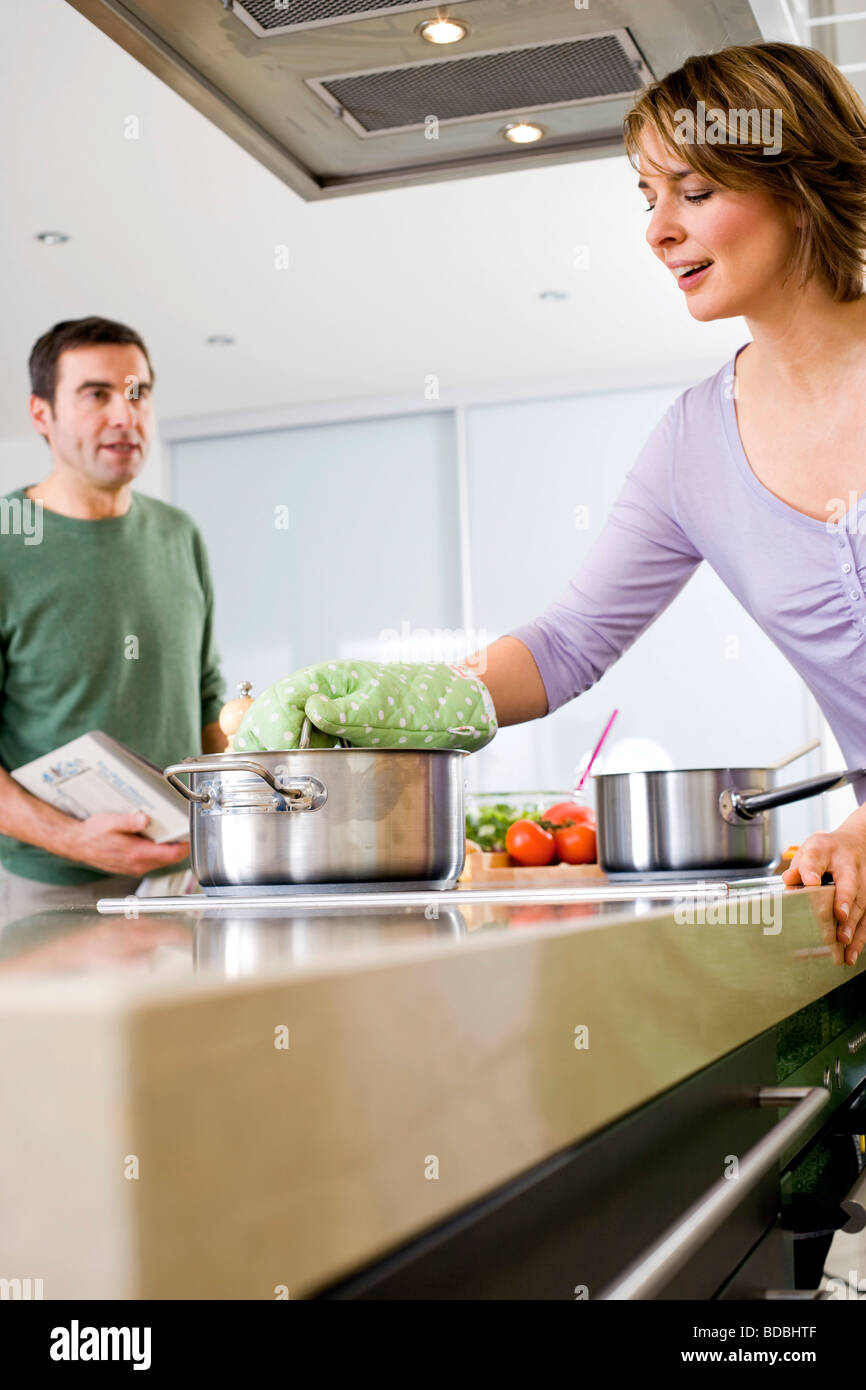 couple cooking together in kitchen Stock Photo - Alamy