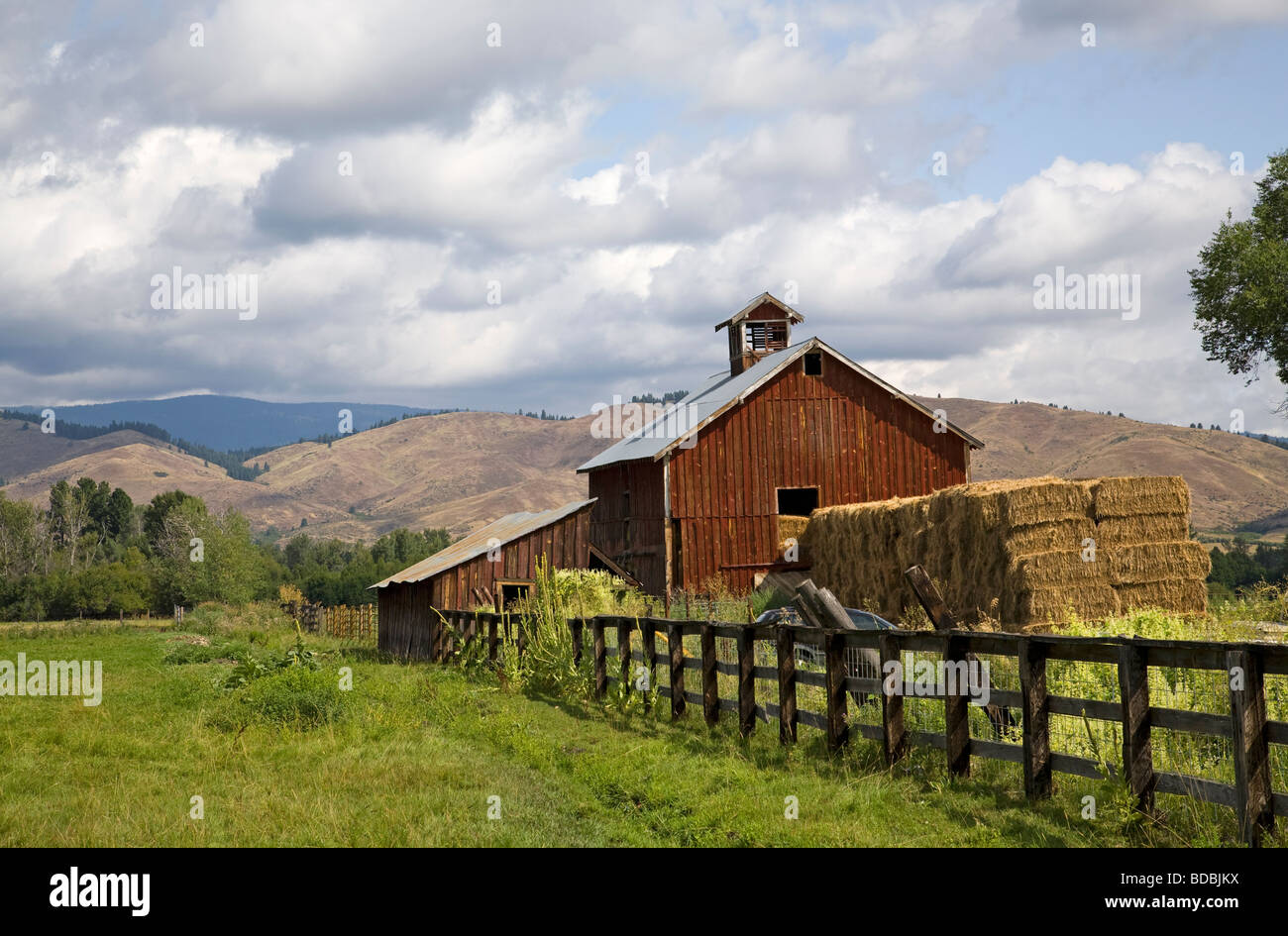 An old red barn and haystack on a ranch near Halfway Oregon on the ...