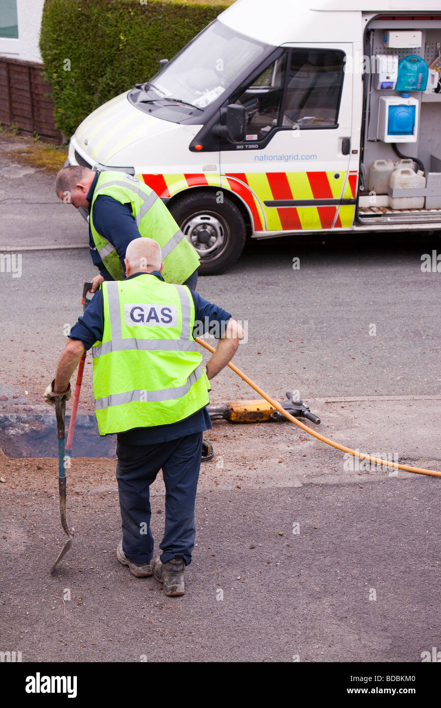 A British Gas worker using a compressed air soil picker to loosen soil ...