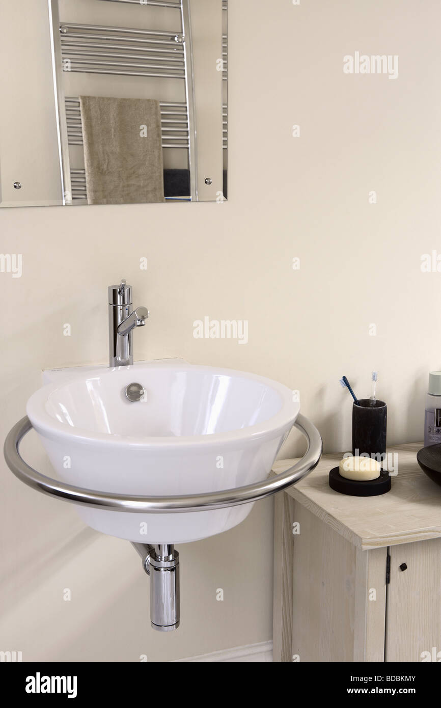 Close up of modern white circular basin with chrome frame Stock Photo ...