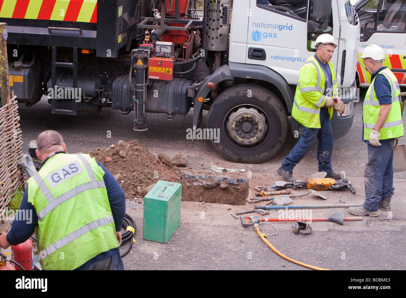 British Gas workers replacing old metal gas pipes with plastic ones ...
