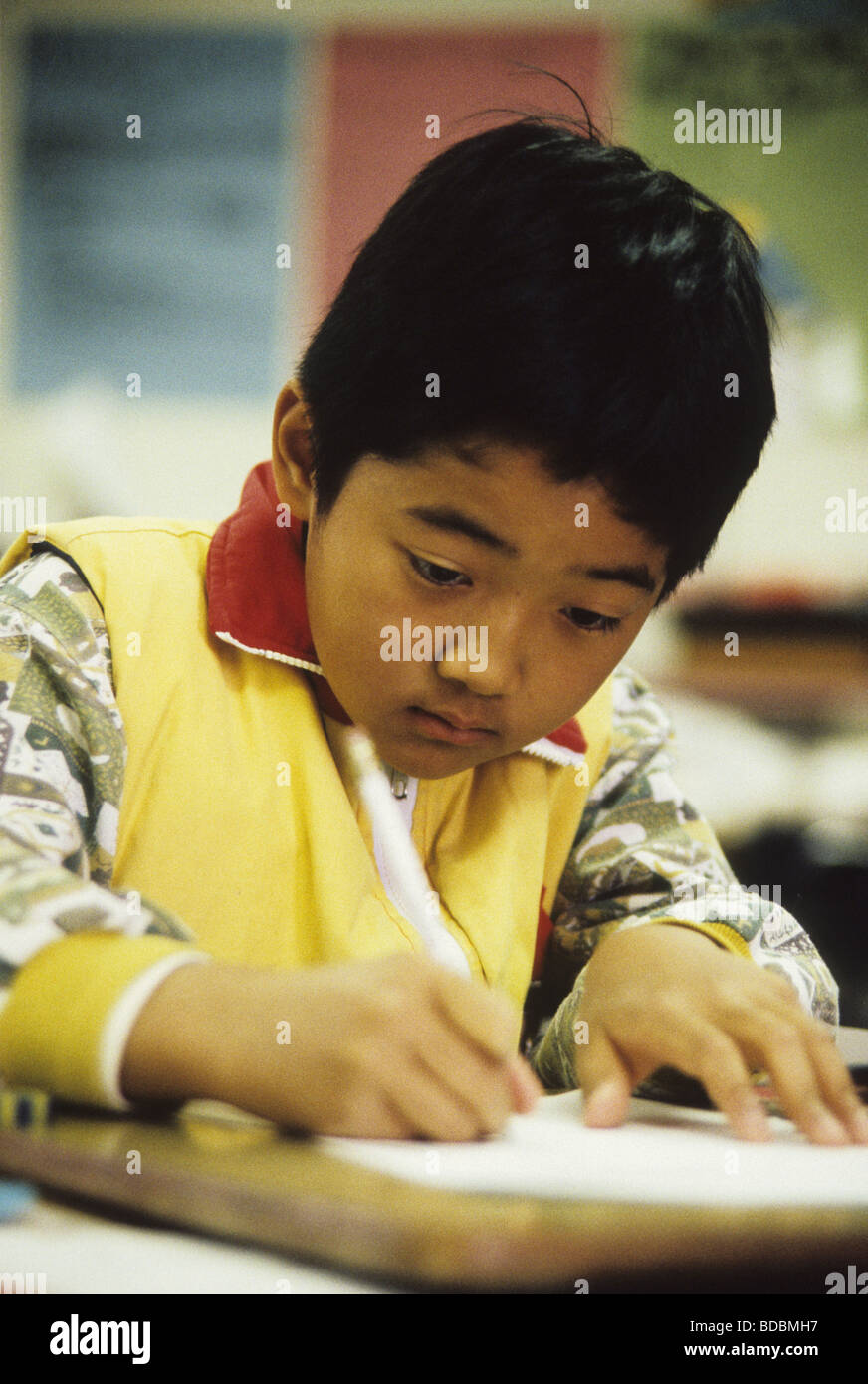 4th grader writing paper Stock Photo - Alamy